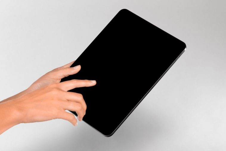 Free Hand Holding iPad Mockup PSD - PsFiles