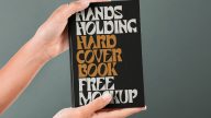 Free Hand Holding Book Cover Mockup PSD - PsFiles