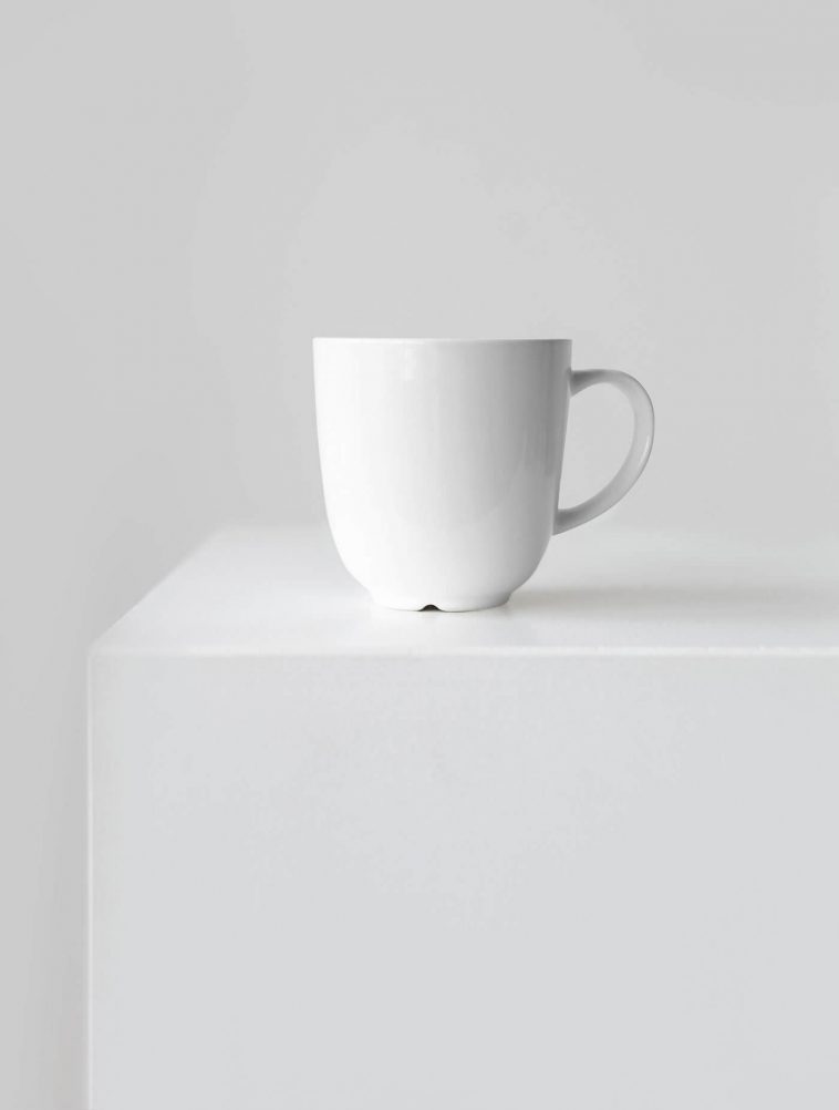 Free Ceramic Mug Mockup PSD on a Cube - PsFiles