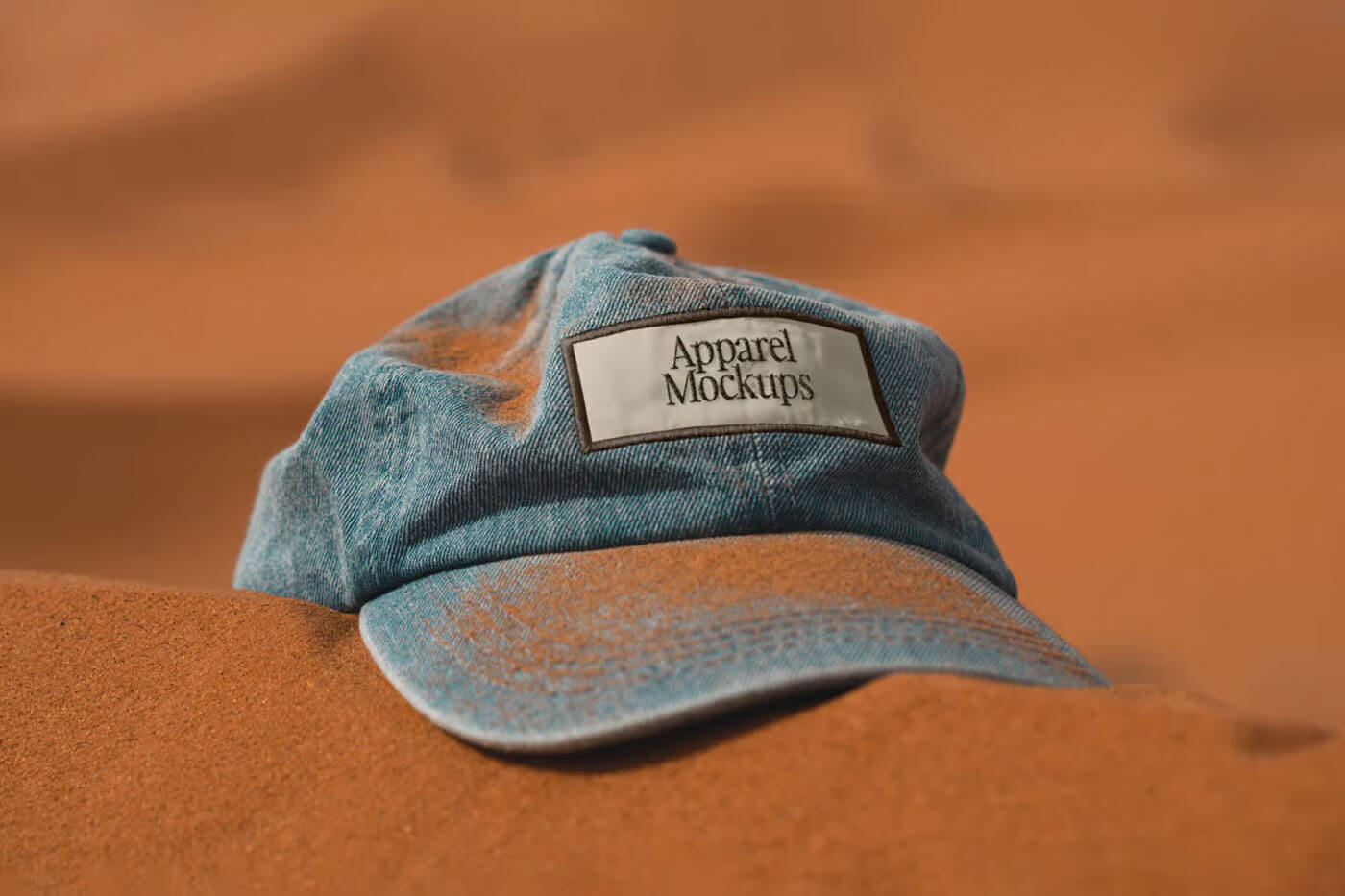 Free Cap Logo Mockup on Desert Sand - PsFiles